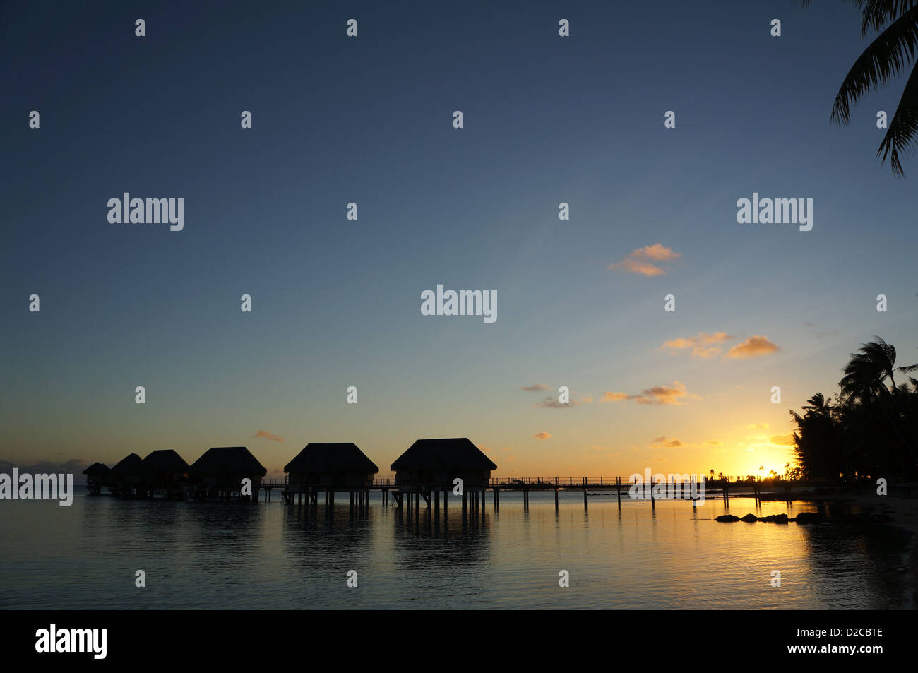 Sunrise over lagoon resort Stock Photo - Alamy