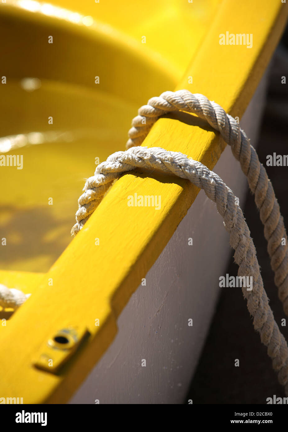 Yellow boat with a rope close-up Stock Photo - Alamy