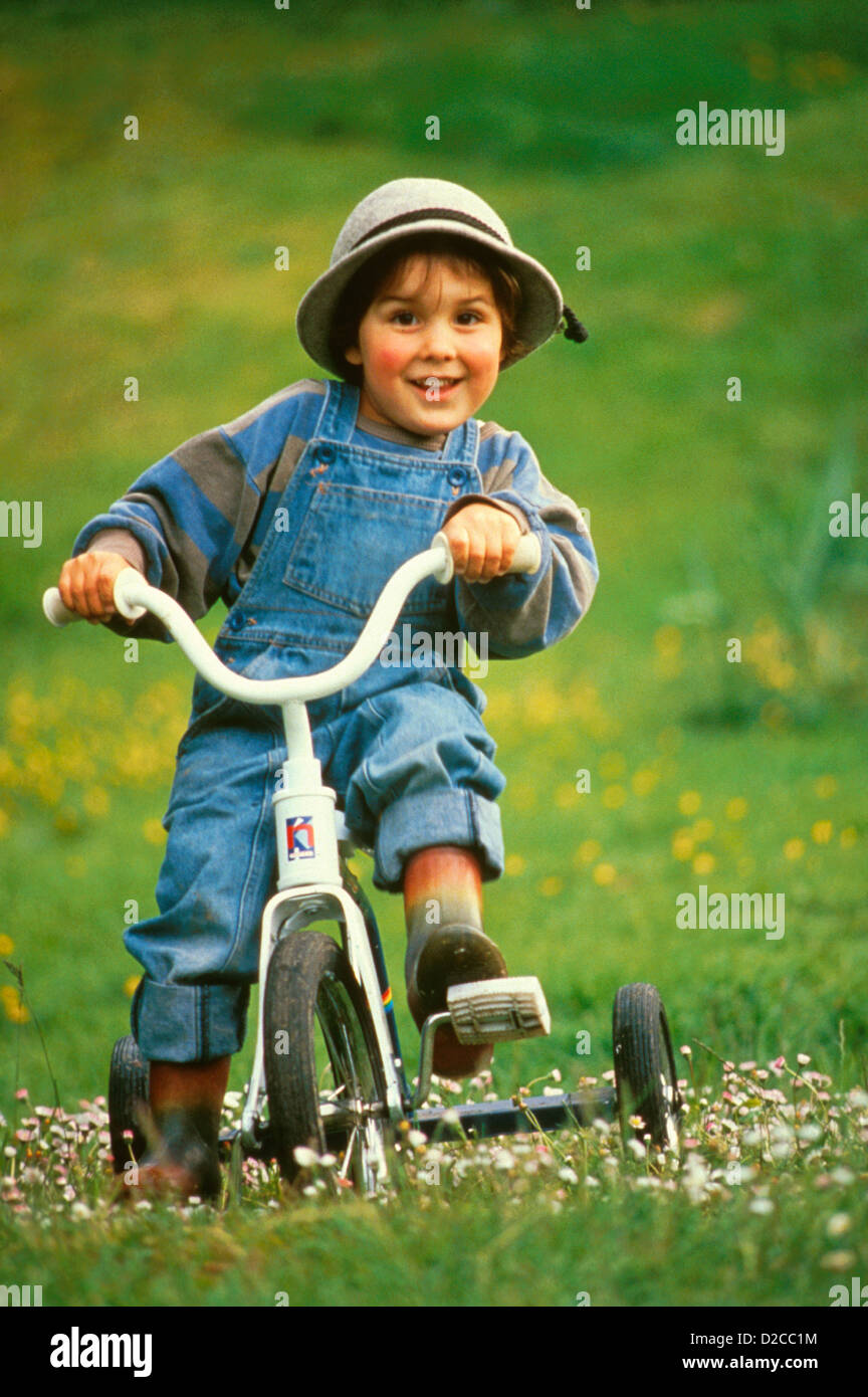 Boy with tricycle hi-res stock photography and images - Alamy
