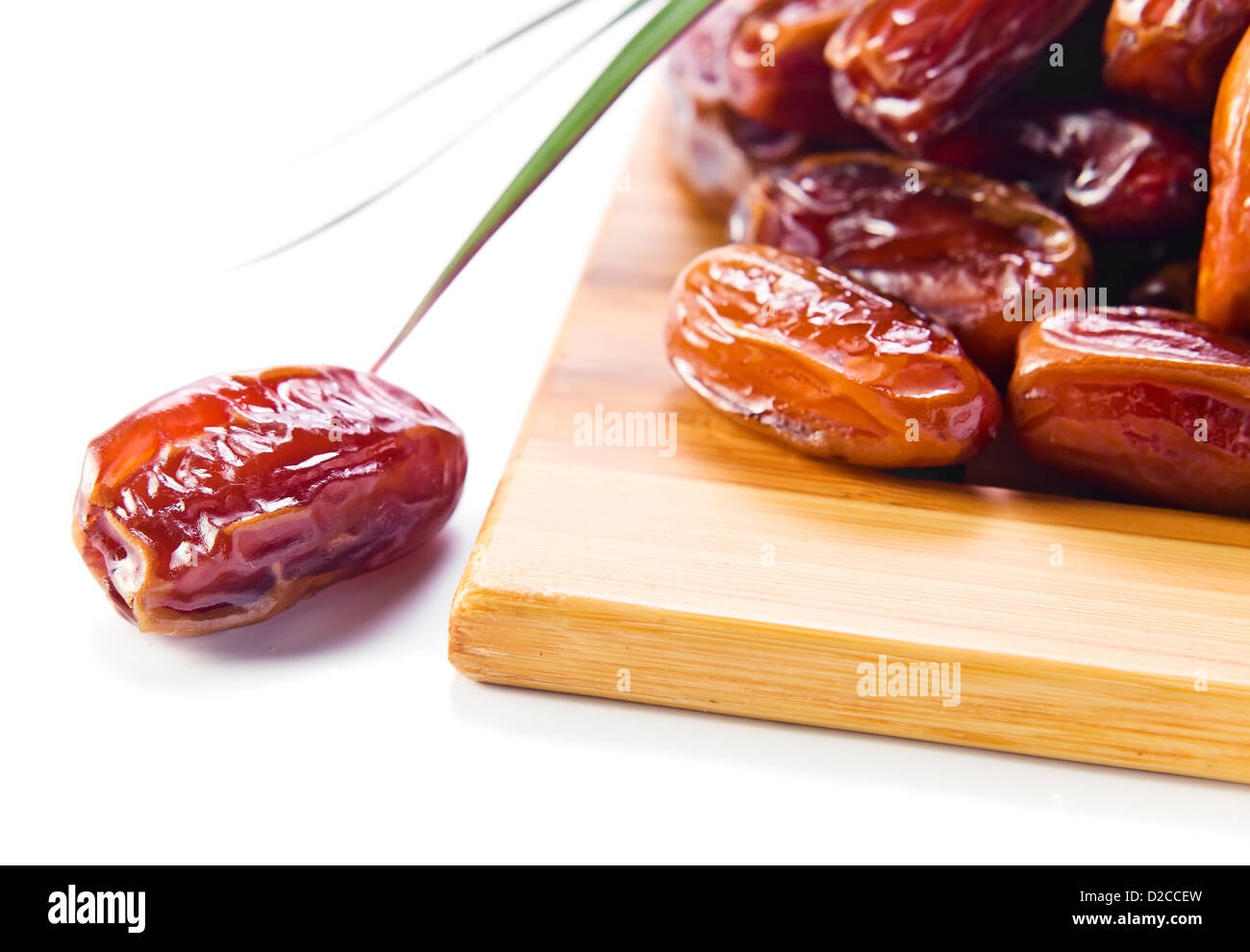 Dried dates isolated on a white background Stock Photo - Alamy