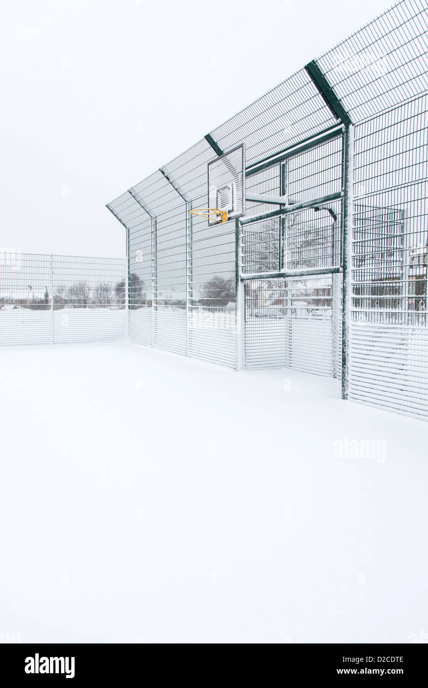 Basketball court covered in snow Stock Photo - Alamy