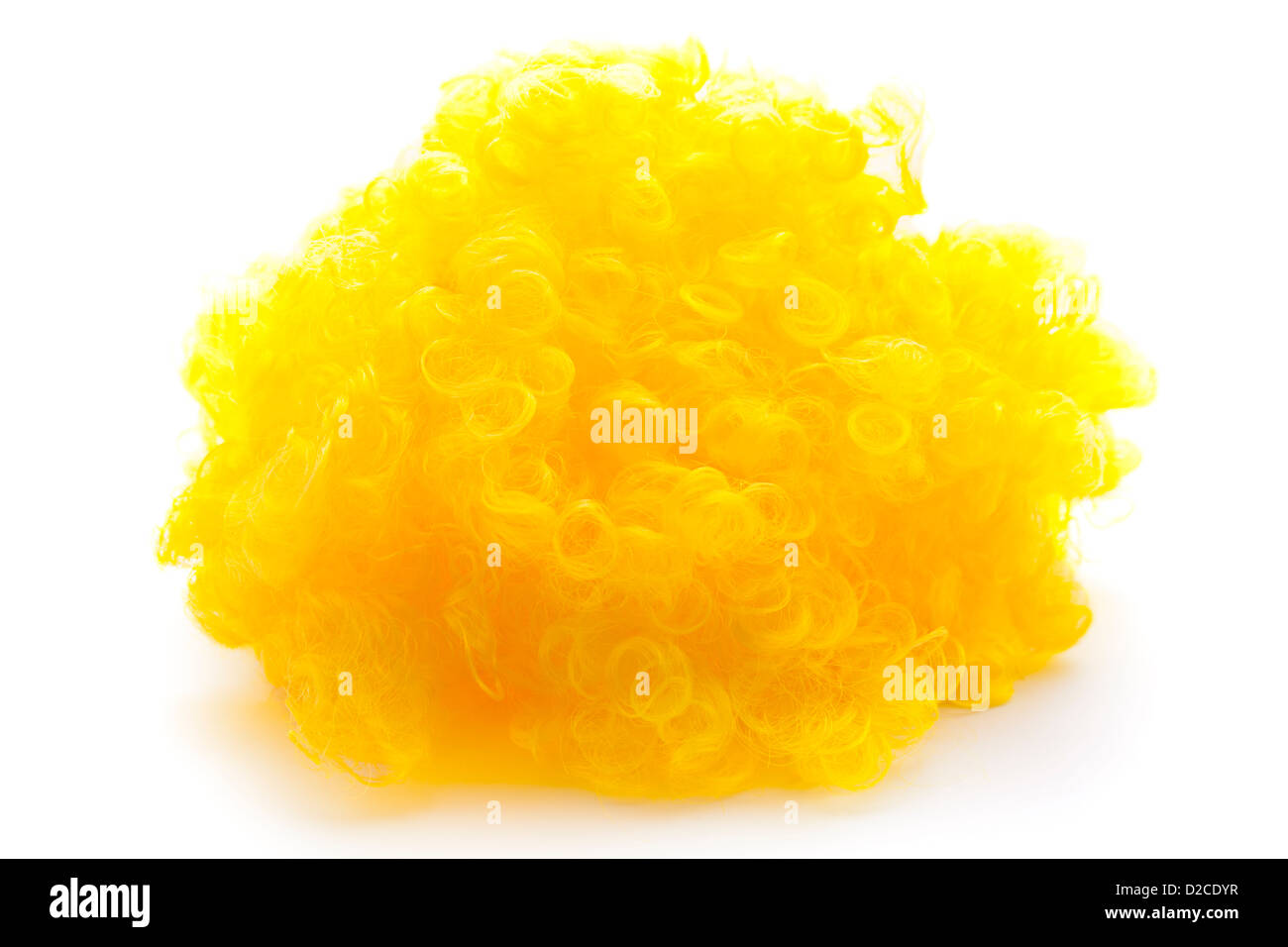 Yellow curly wig over white background Stock Photo - Alamy