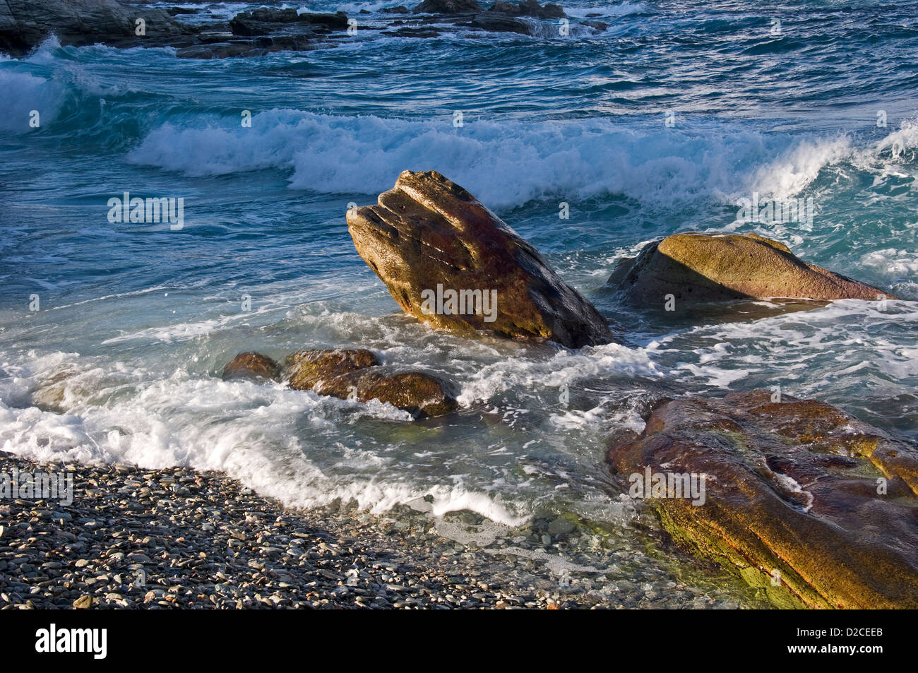 Waves breaking on rocky beach Stock Photo - Alamy