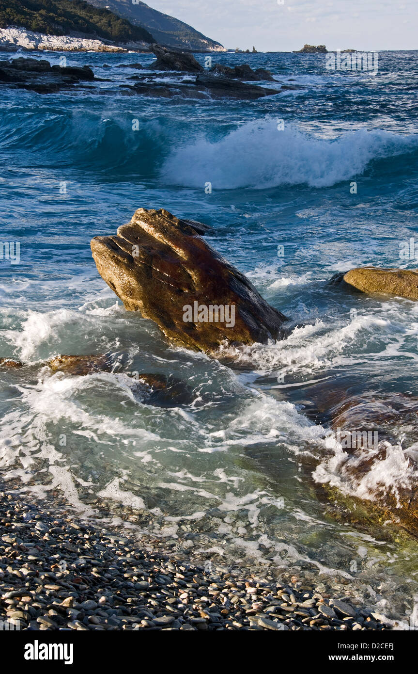 Waves breaking on rocky beach Stock Photo - Alamy