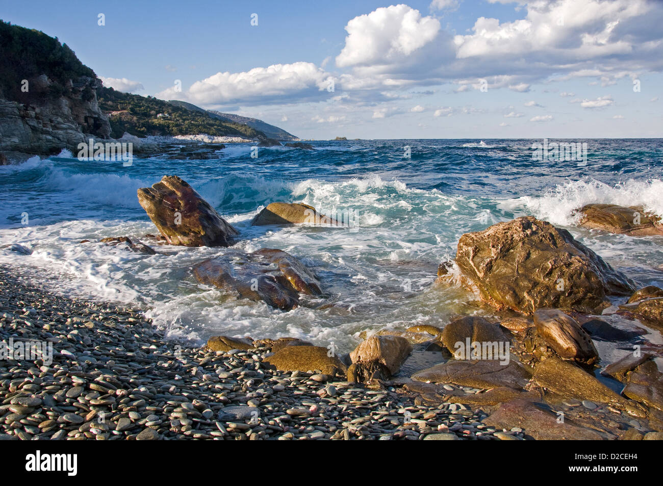 Waves breaking on rocky beach Stock Photo - Alamy