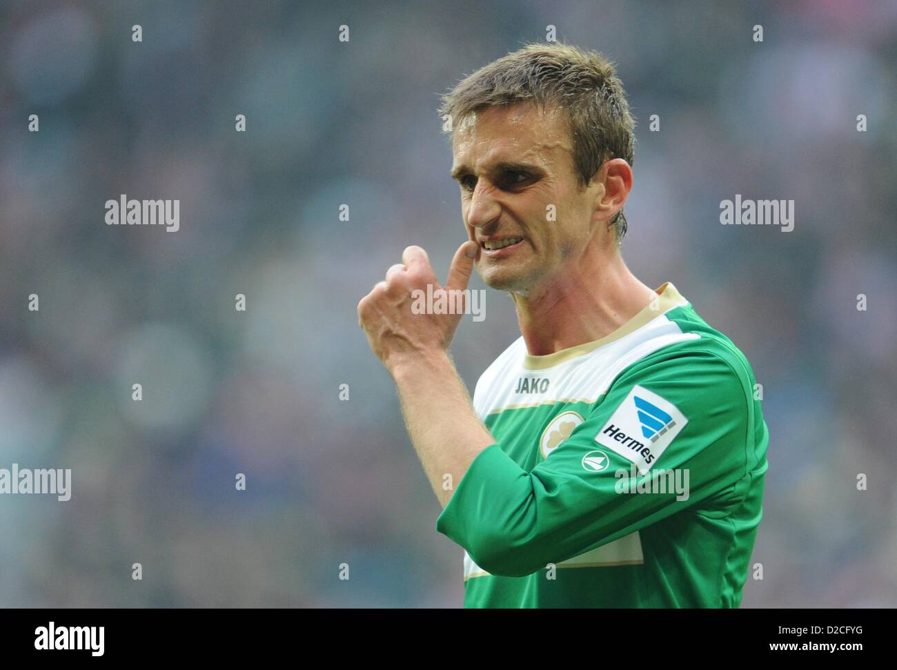 Fuerth's Milorad Pekovic grabs his nose during the Bundesliga soccer ...