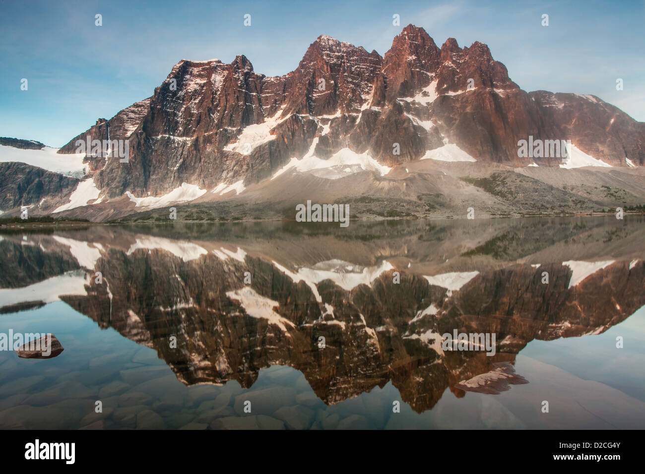 The Ramparts reflected in Amethyst Lakes in the Tonquin Valley at ...