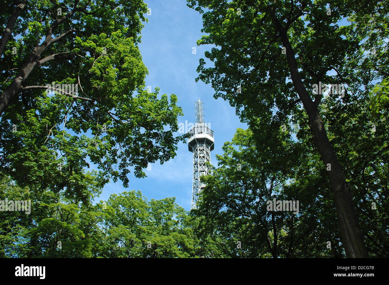 View of the observation tower on Petrin Hill in Prague through trees ...