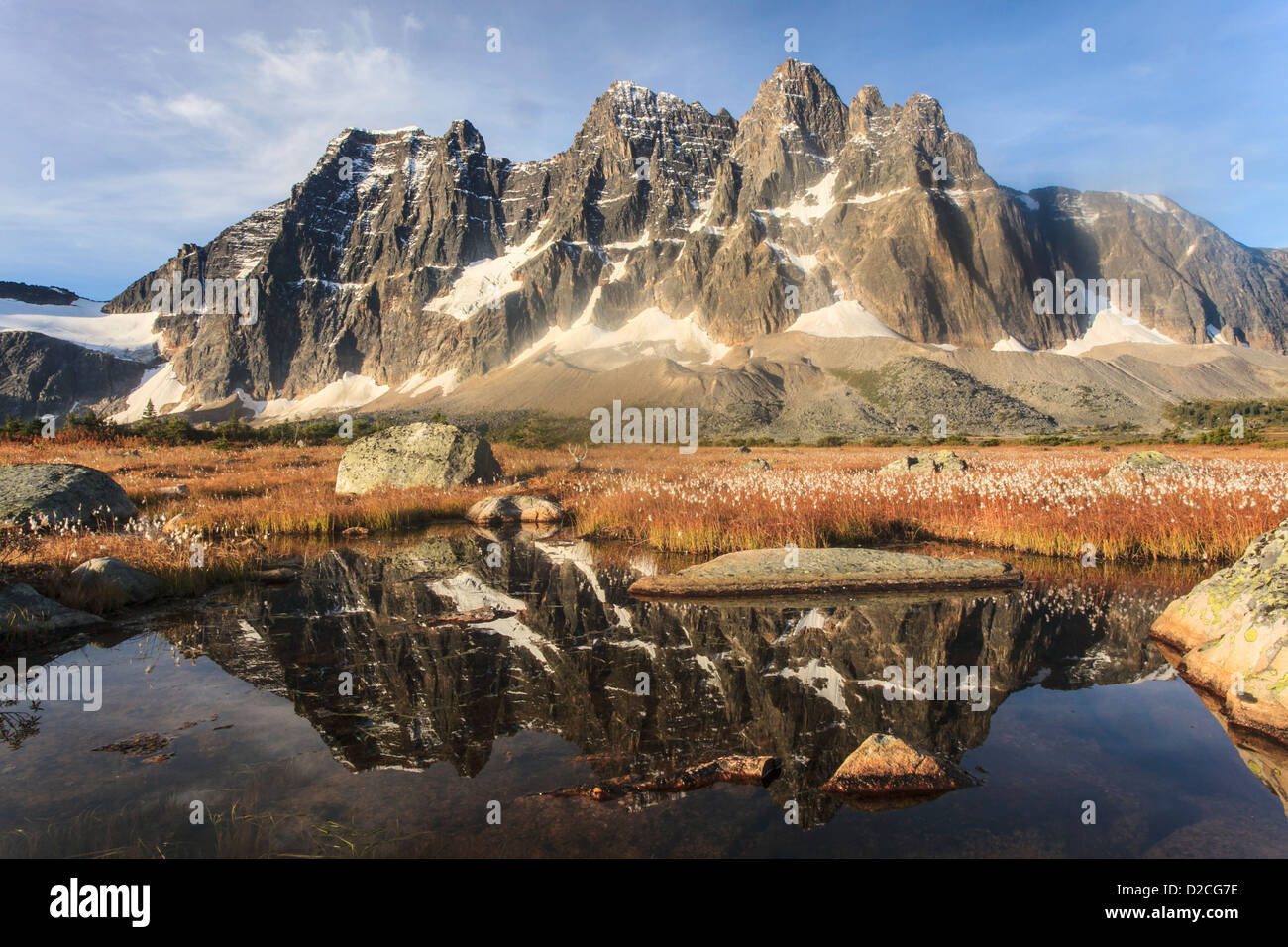 The Ramparts reflected in a pool near Amethyst Lakes in the Tonquin ...
