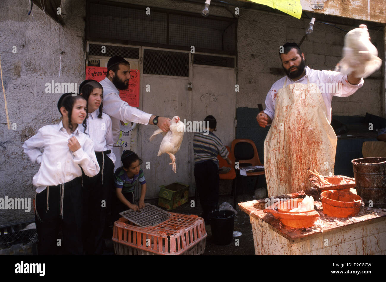 Native people butchering hi-res stock photography and images - Alamy