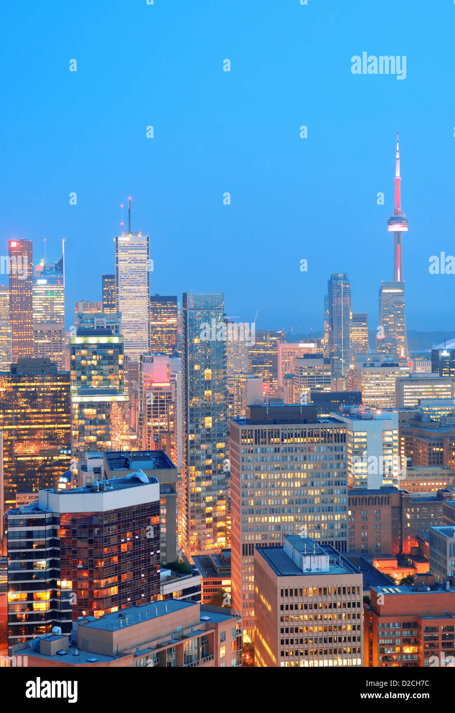 Toronto at dusk with city light and urban skyline with skyscrapers ...