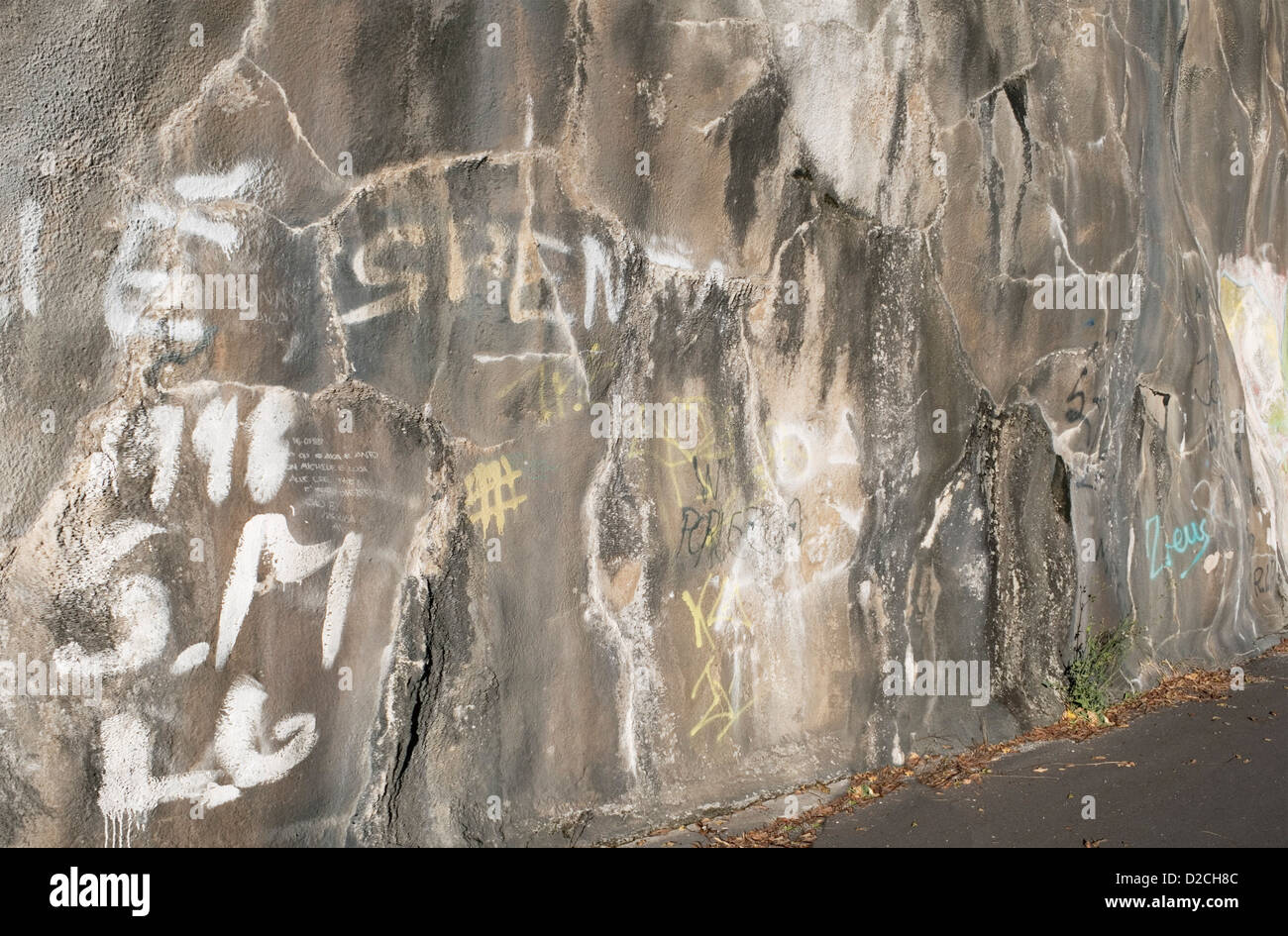 graffiti and writings on rock wall Stock Photo - Alamy