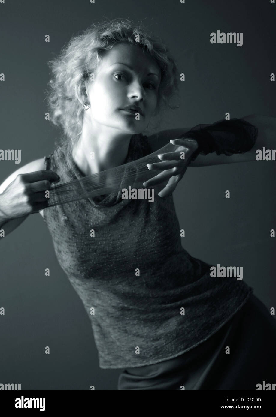 The beautiful girl covered with light at the left with movement of ...