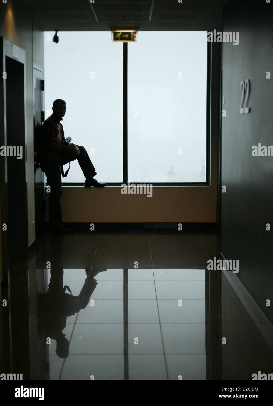 The man with reflection stands at a window Stock Photo - Alamy