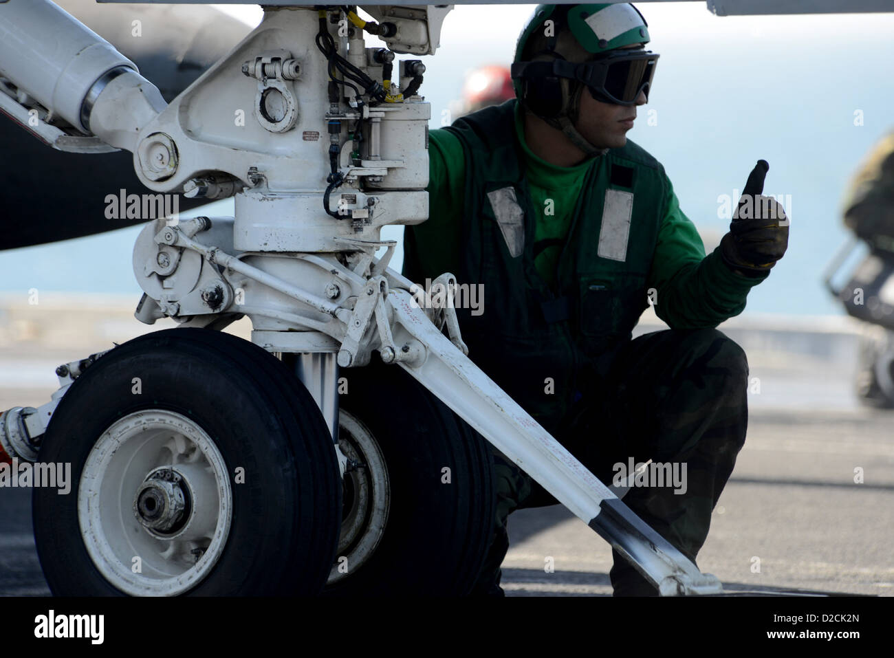 - A Sailor signals for the forward movement of an aircraft on the ...