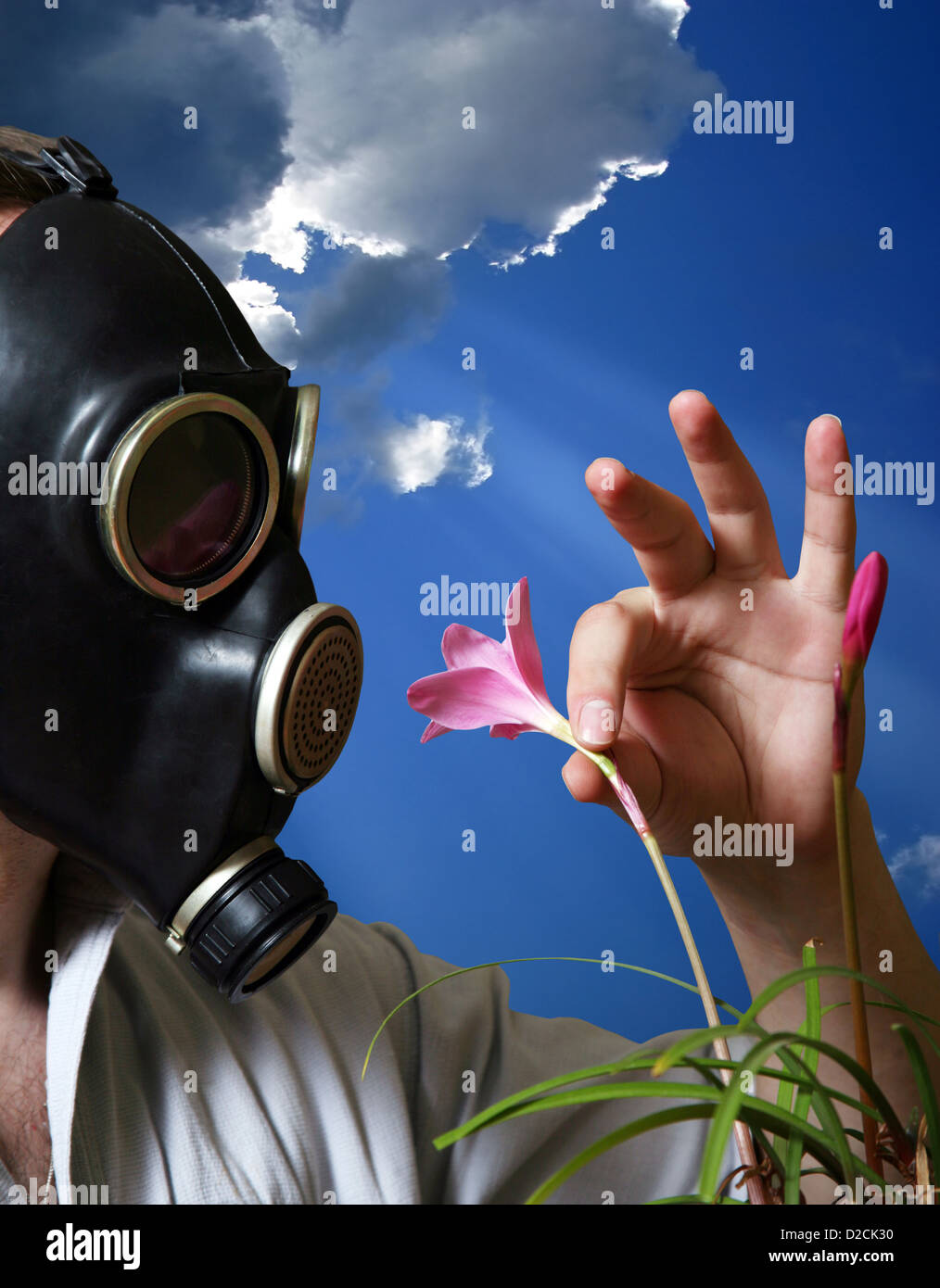 The man in a gas mask with flowers Stock Photo - Alamy