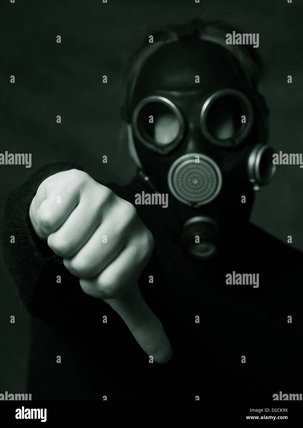 Hand of man in gas mask showing the hand down symbol Stock Photo - Alamy