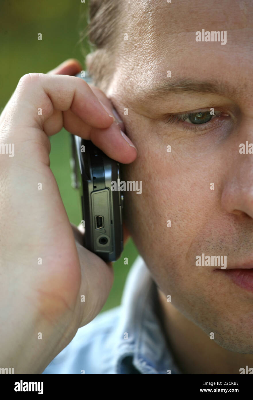 Portrait of the man with the phone close-up Stock Photo - Alamy