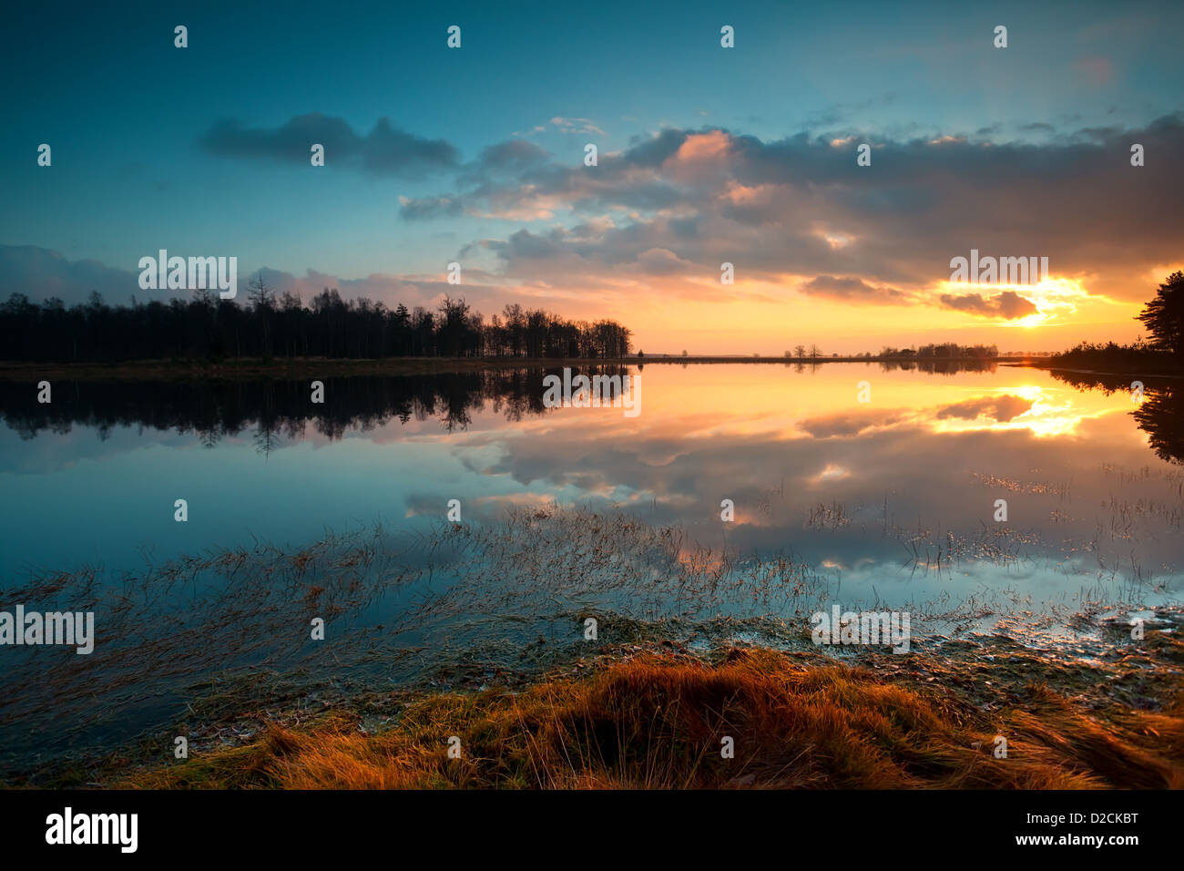 dramatic calm sunset over lake in Dwingelderveld Stock Photo - Alamy