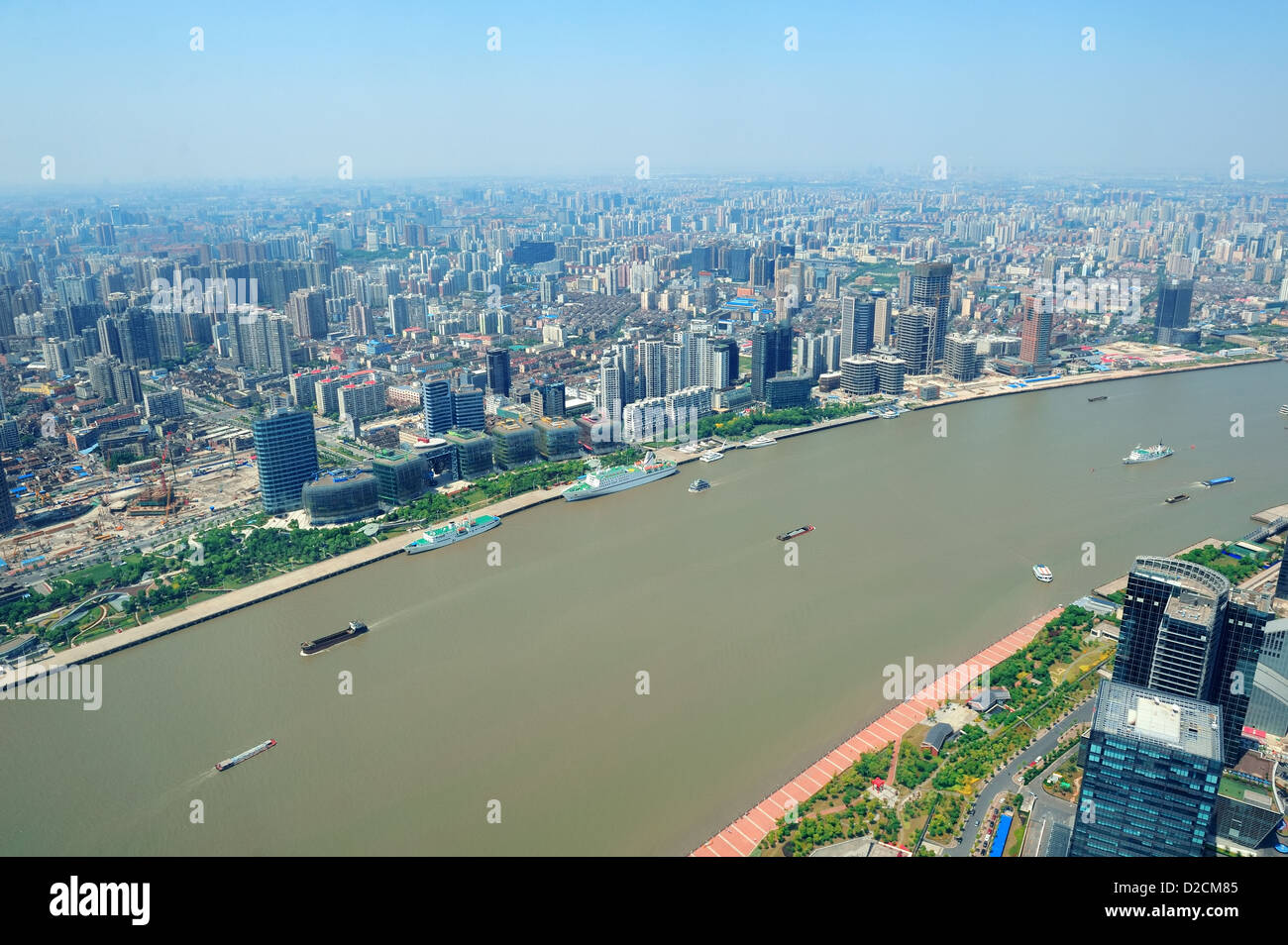 Shanghai city aerial view with urban architecture over river and blue ...