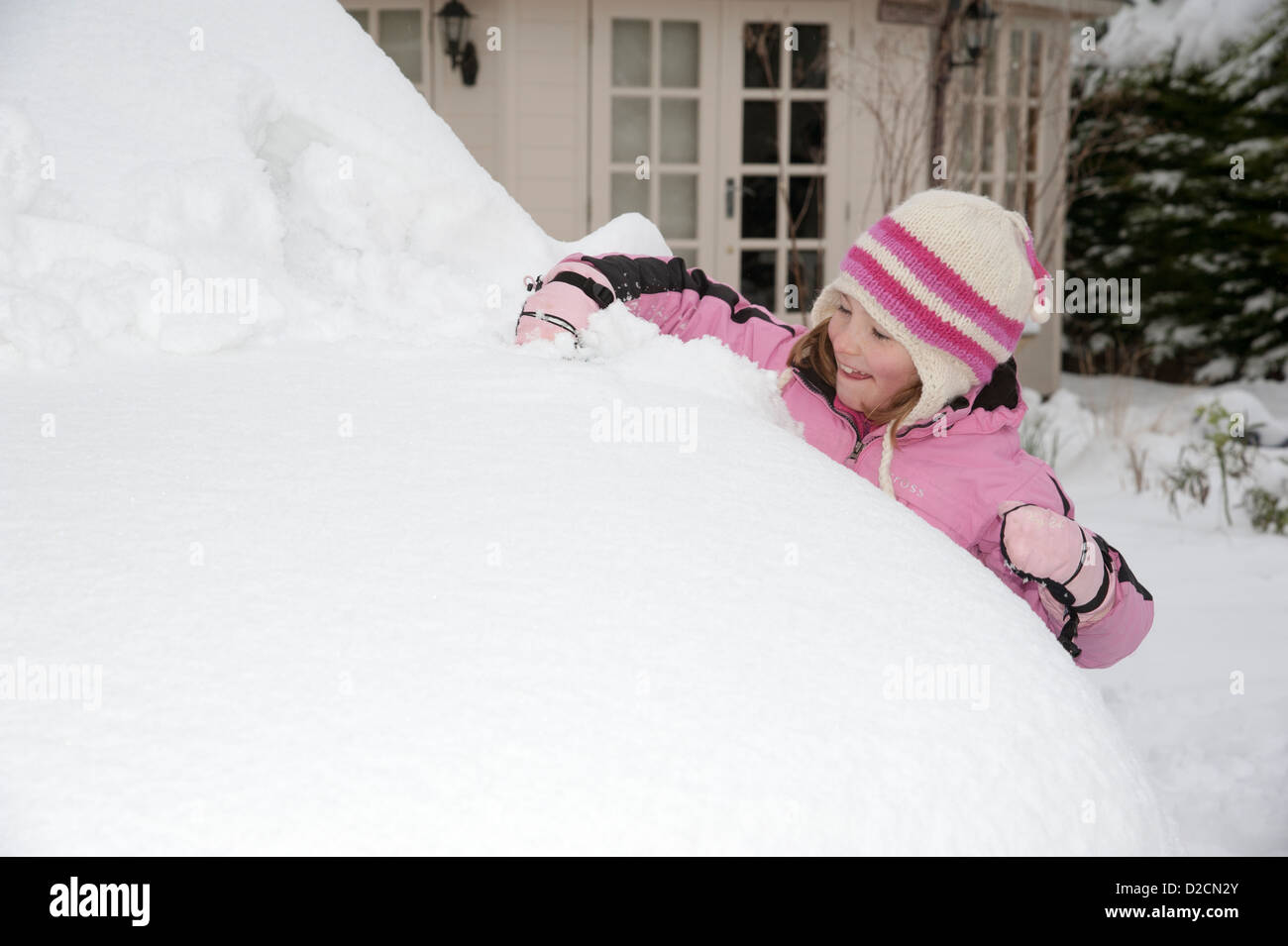 Young girl clearing snow from a car Stock Photo - Alamy Young girl clearing snow from a car Stock Photo - Alamy