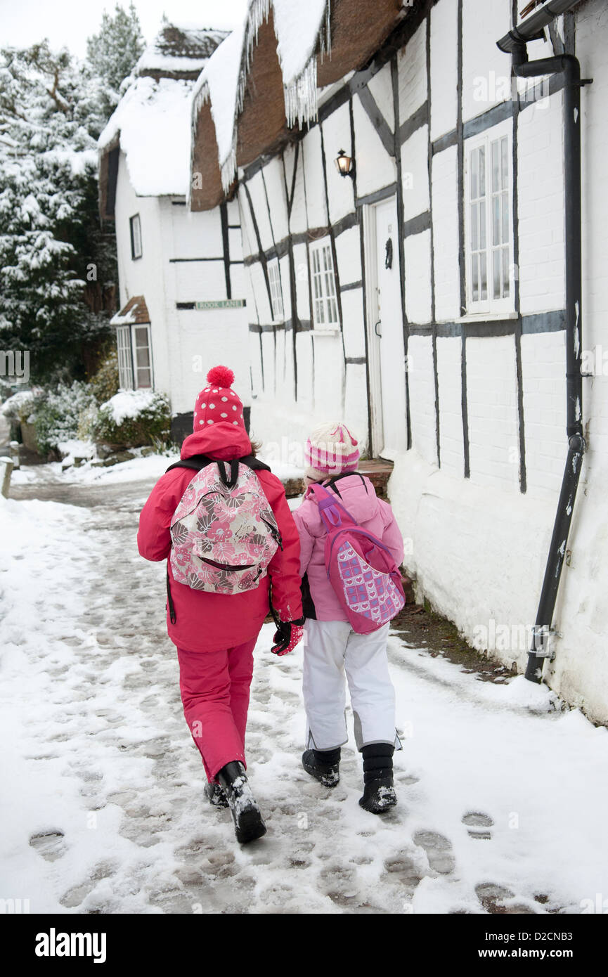 Walking to school on a cold winter morning with pavement covered in ice ...