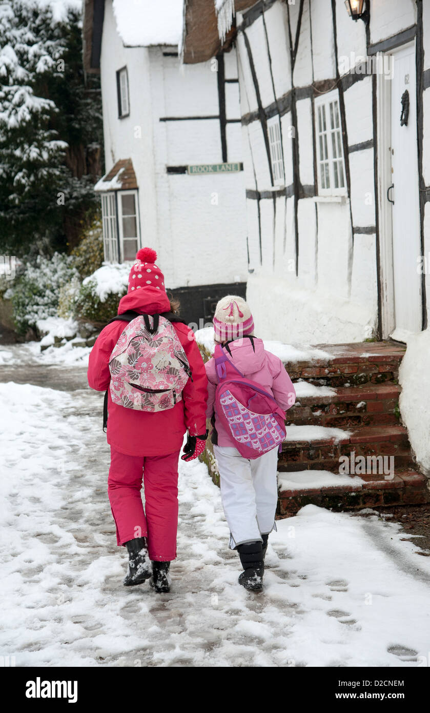 Walking to school on a cold winter morning with pavement covered in ice ...
