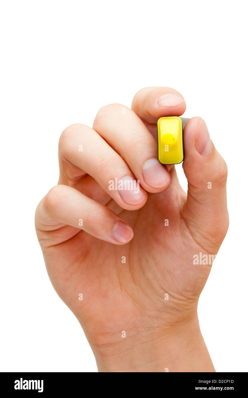 Hand holding a yellow felt tip pen isolated on white with copy space ...