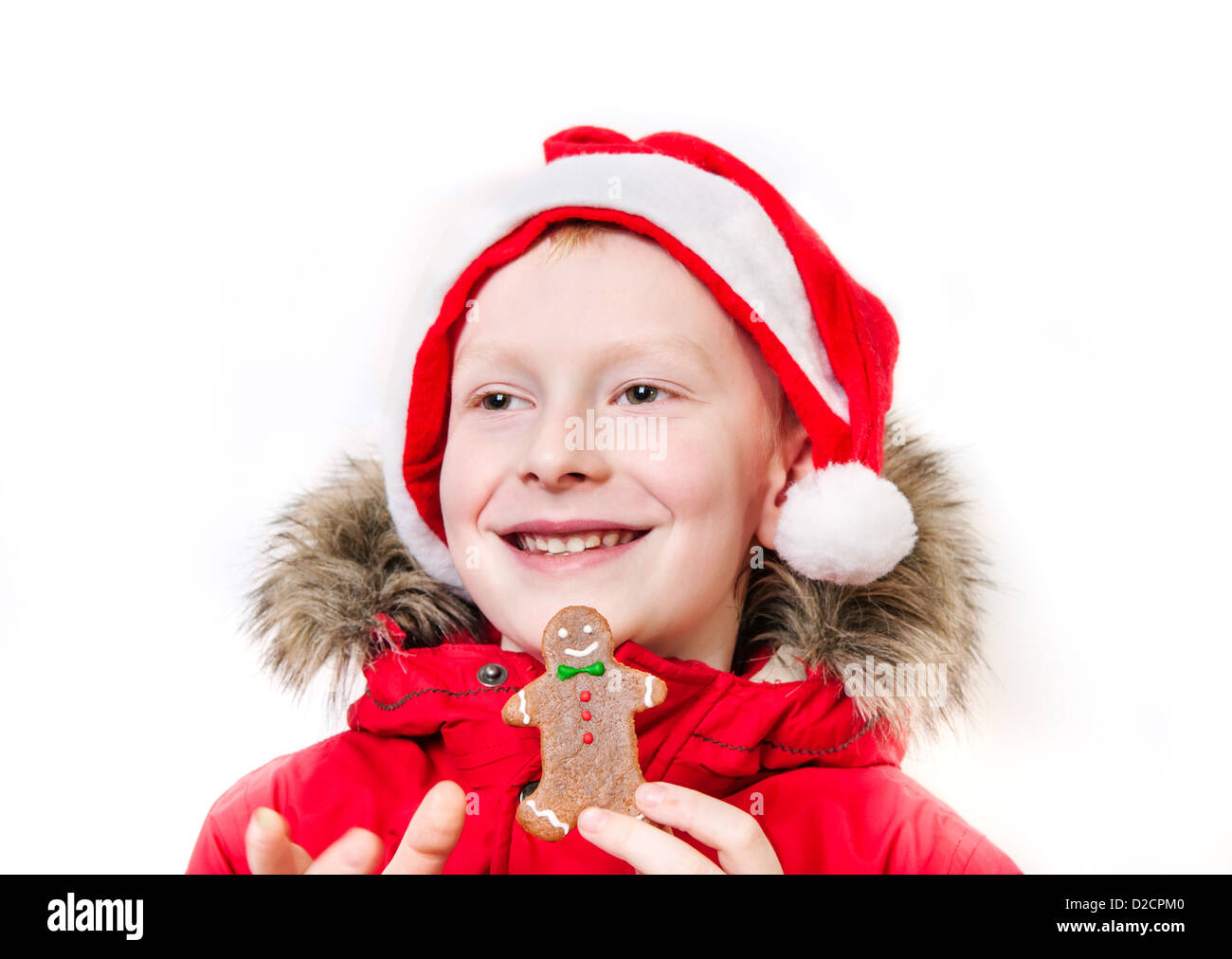 Boy wearing santa hat eating hi-res stock photography and images - Alamy