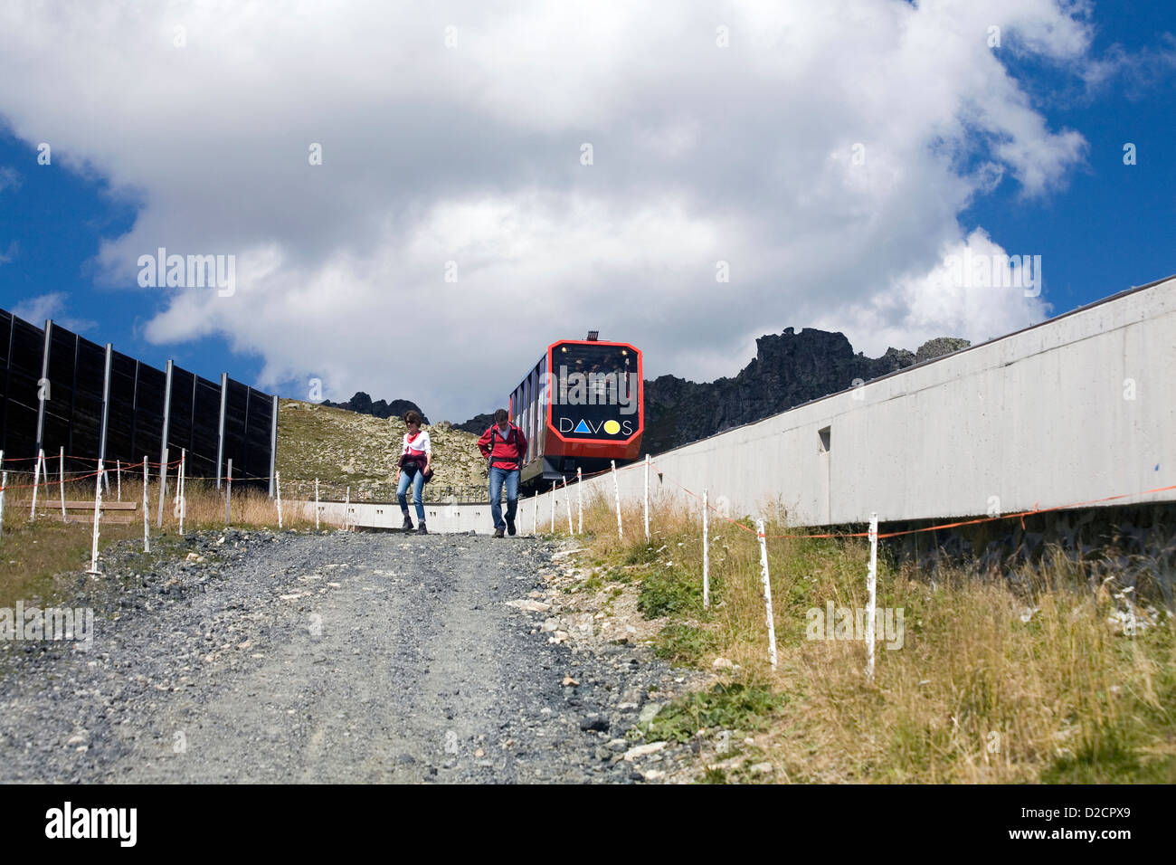 Hikers by Parsennbahn Finicular Railway climbing the Dorftalli from ...
