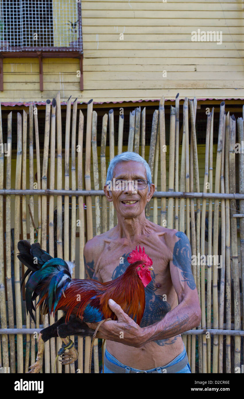 Man and chicken, Puerto Princesa, Palawan,Philippines Stock Photo - Alamy