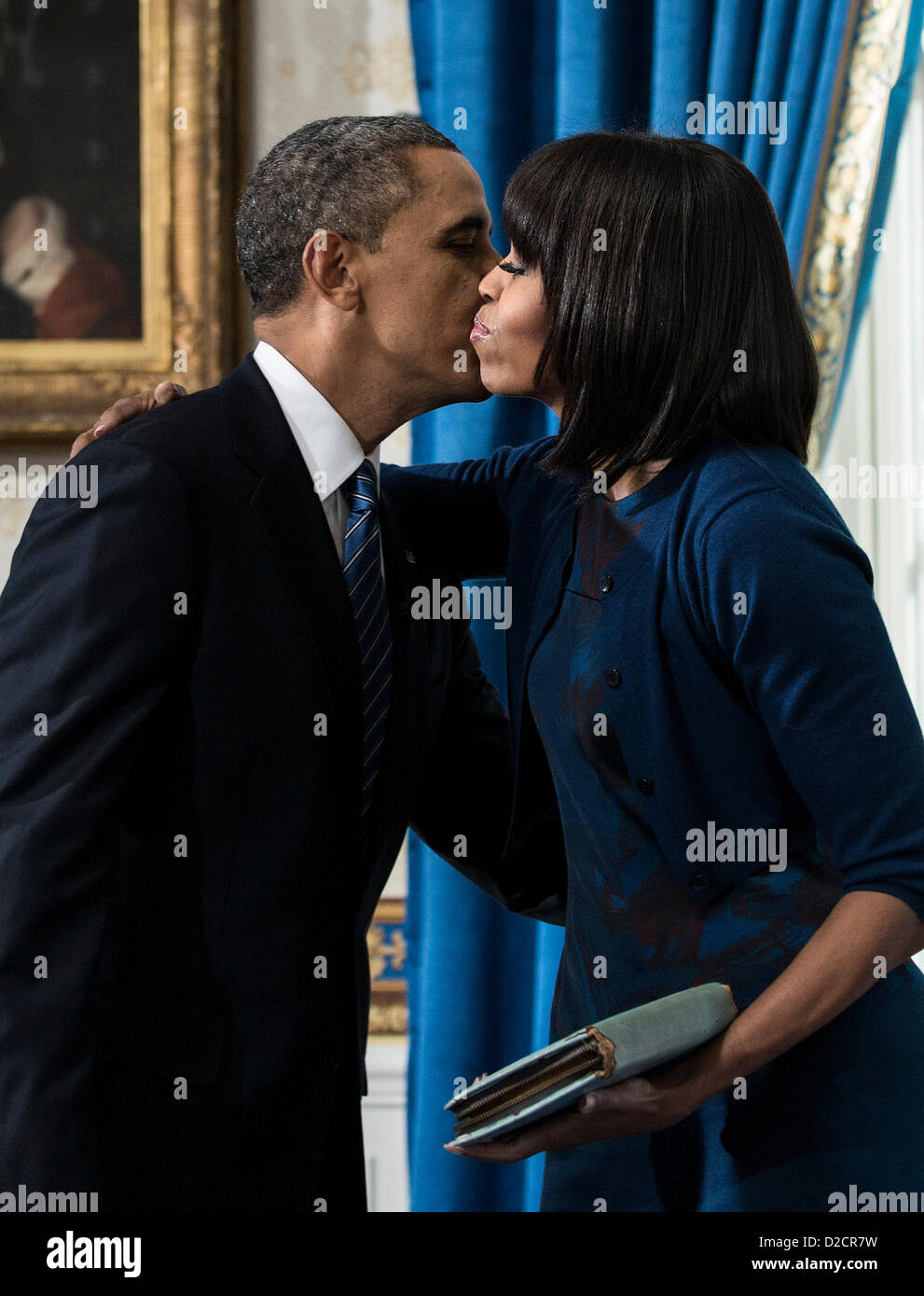 United States President Barack Obama kisses US first lady Michelle ...