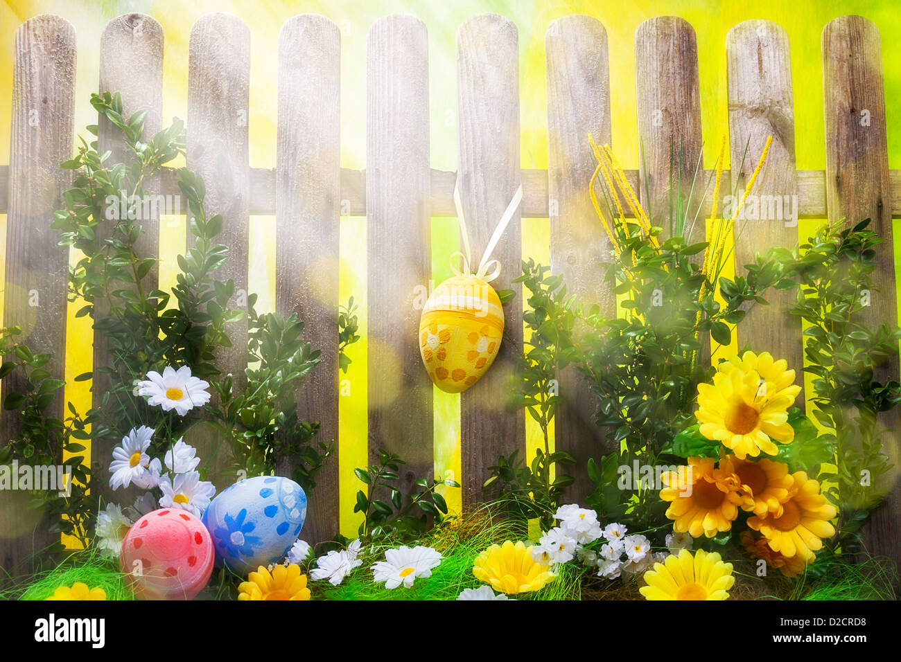 Art easter background with fence, eggs, spring flowers for design or ...