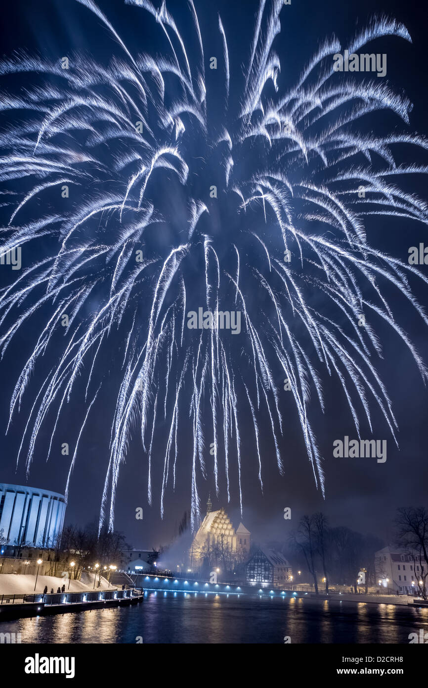 Big spectacular fireworks over river at night Stock Photo - Alamy