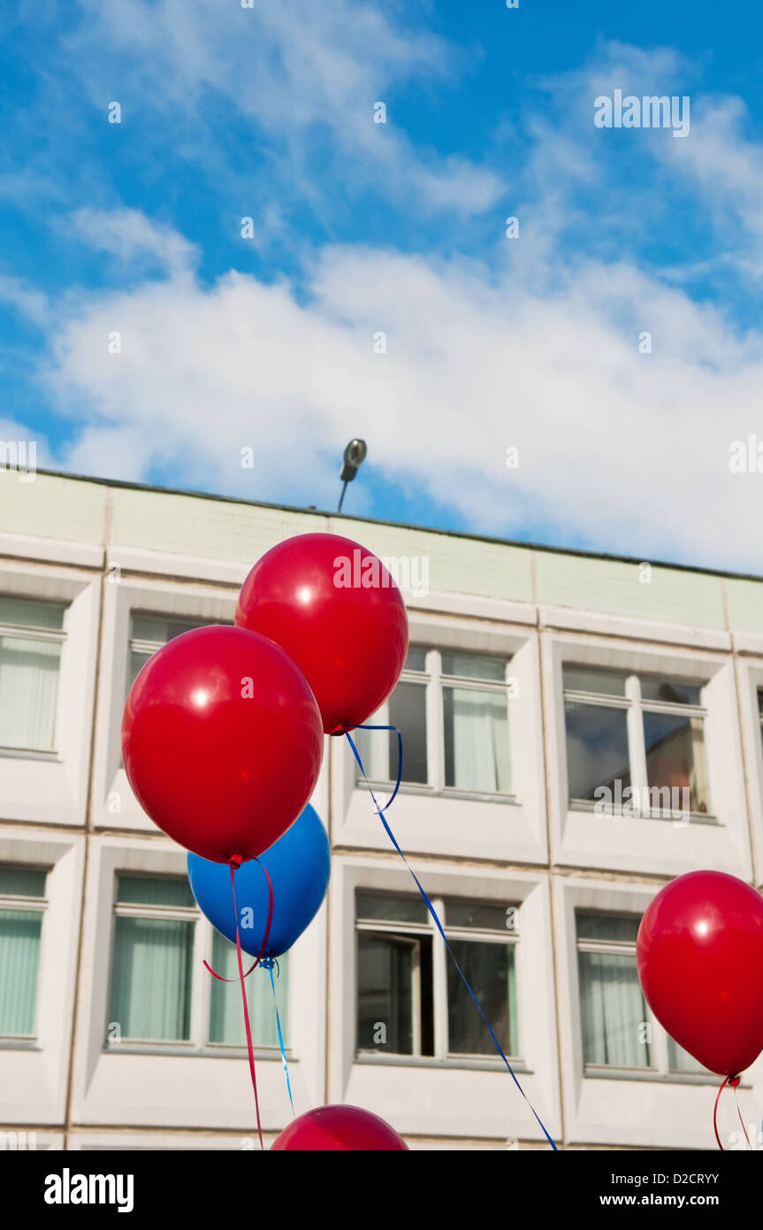 red and blue balloons in front of school building, September 1st ...