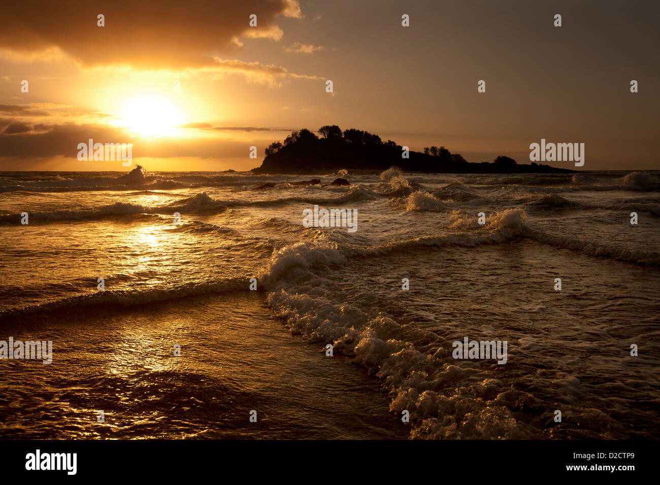 Cross waves wrap around an island and collide inshore on the beach at ...