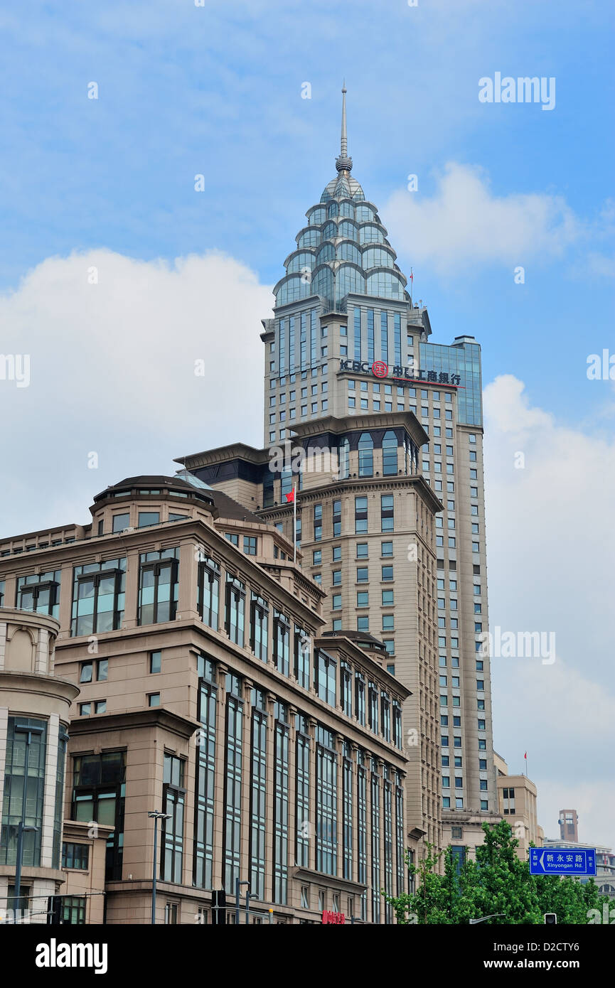 Shanghai Waitan district with historic buildings and street with blue ...