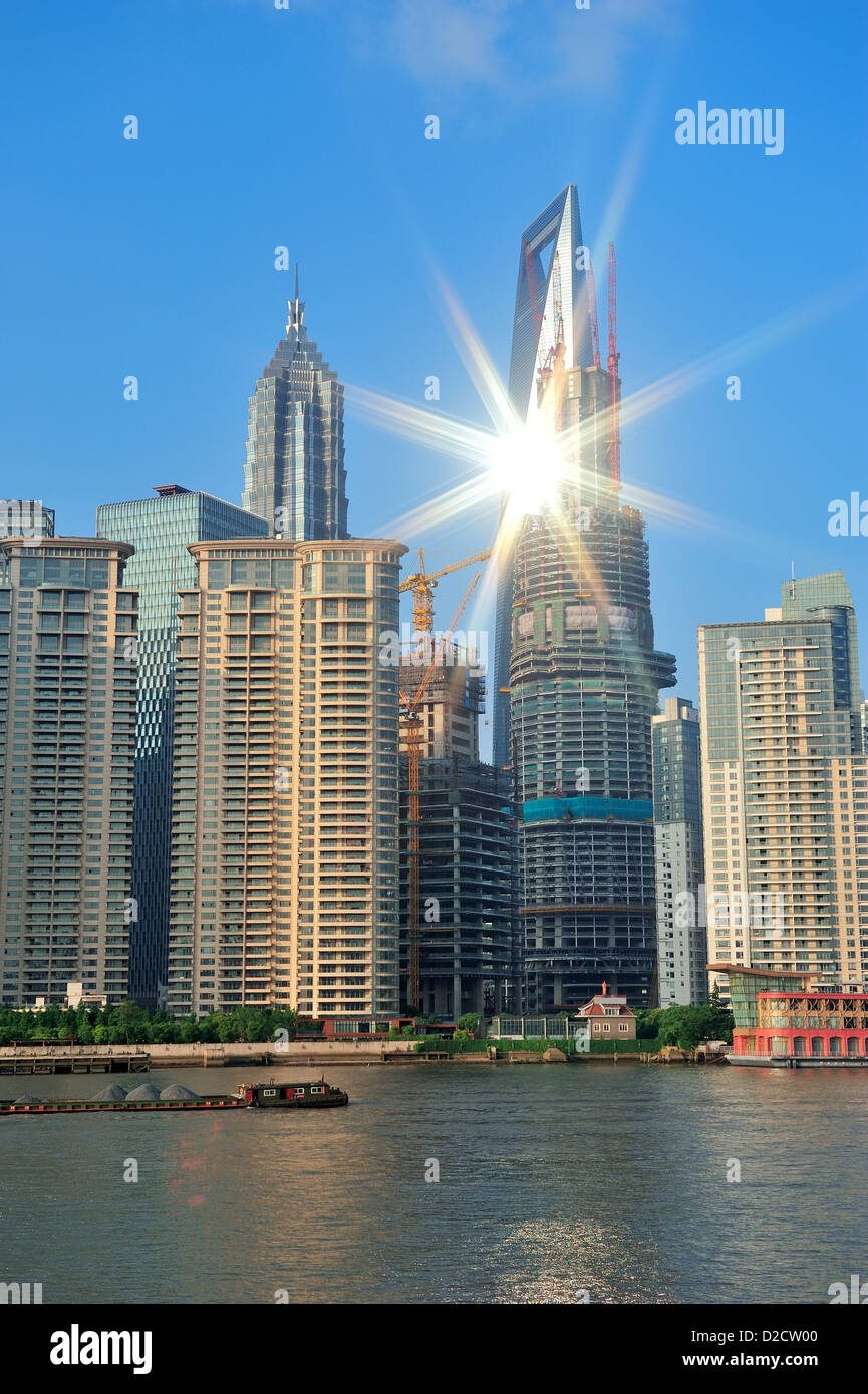Shanghai urban architecture and skyline with sun light reflection over ...