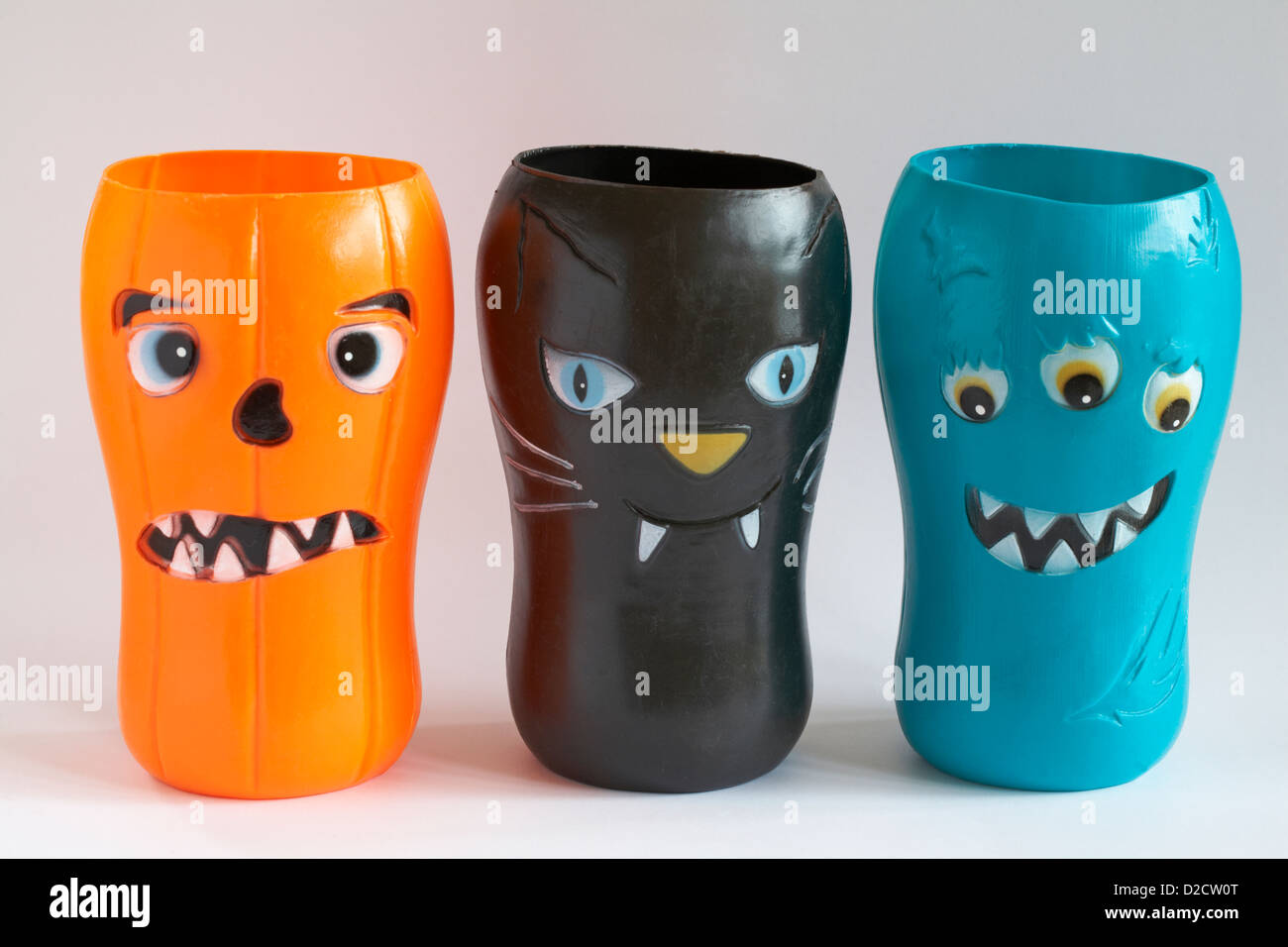 scary halloween faces on plastic beakers isolated on white background ...