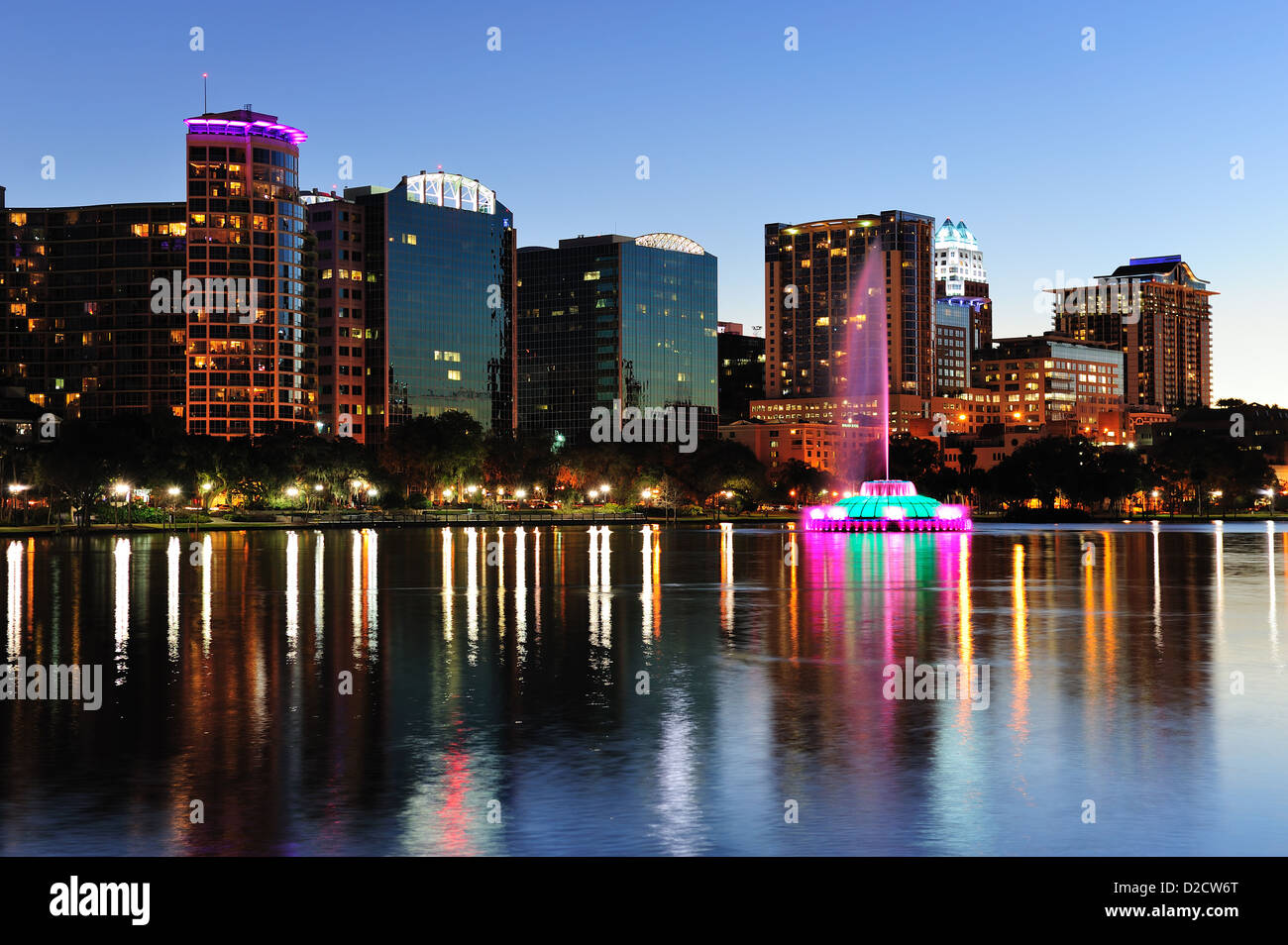 Orlando downtown skyline panorama over Lake Eola at dusk with urban ...