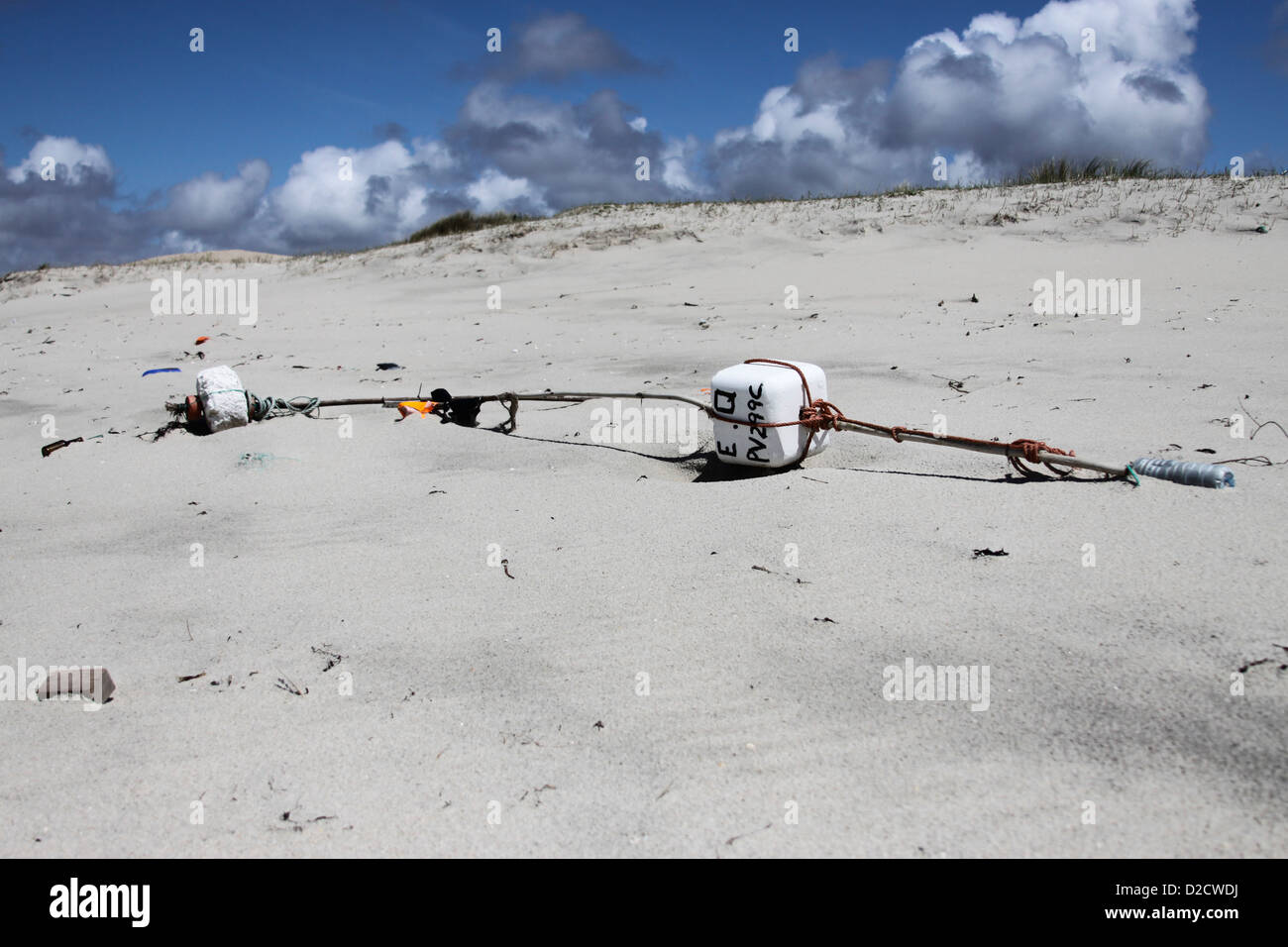 Fishing floater sign came to shore Stock Photo - Alamy
