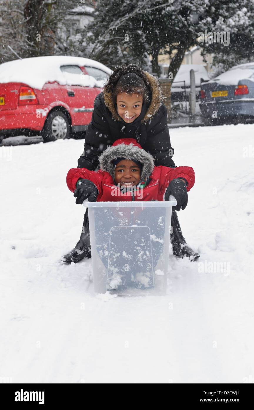 Children snowing playing hi-res stock photography and images - Alamy