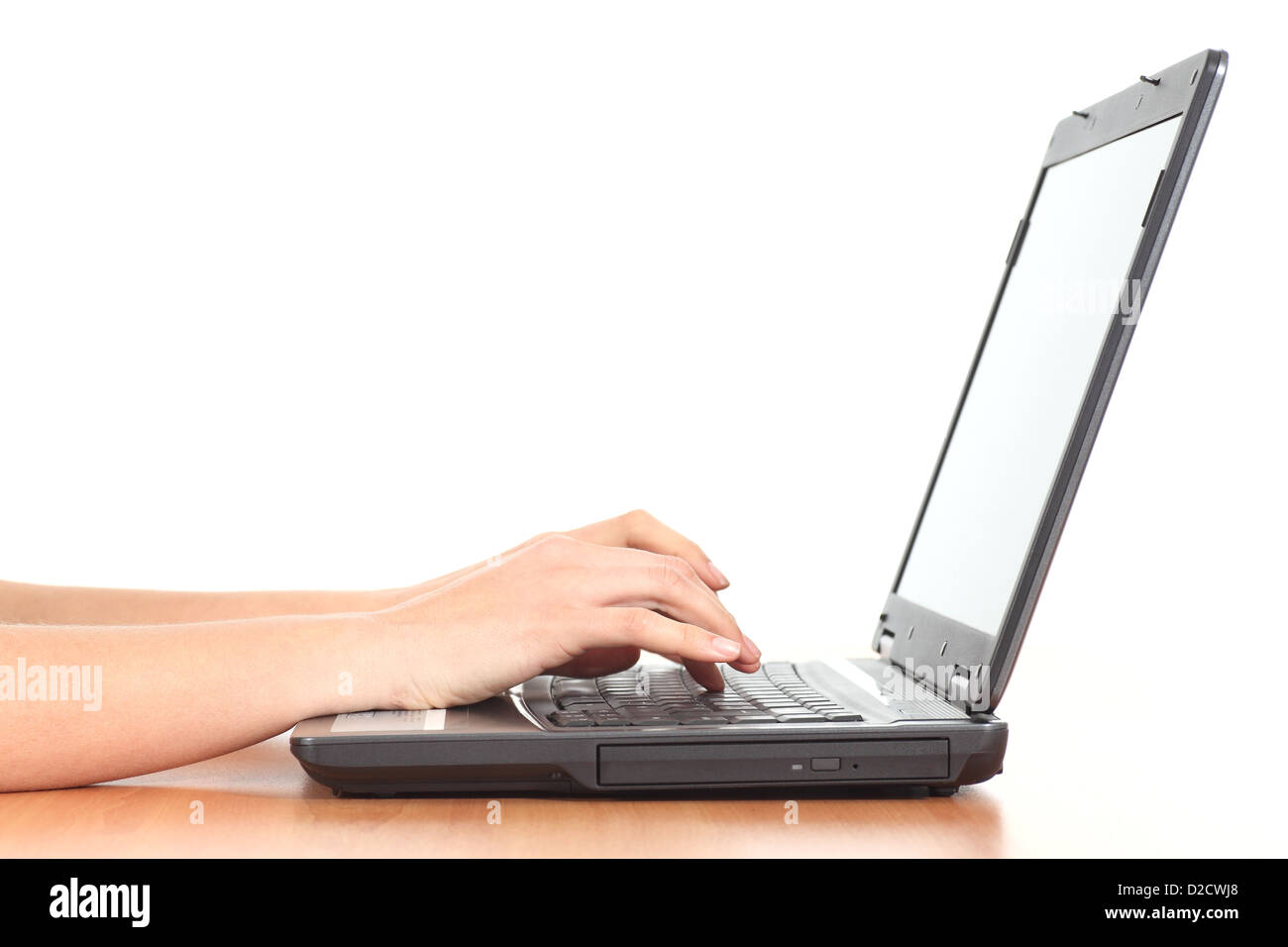 Beautiful woman hands typing on a laptop on an office table in a white ...