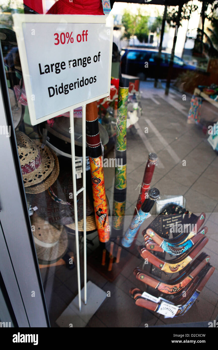 A sign advertising didgeridoos for sale at reduced prices in a high ...