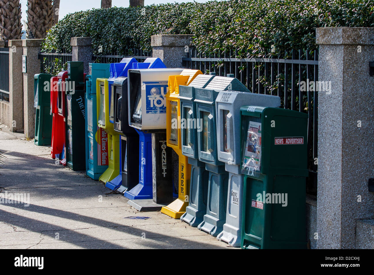 A variety of newspaper boxes on a city sidewalk Stock Photo - Alamy