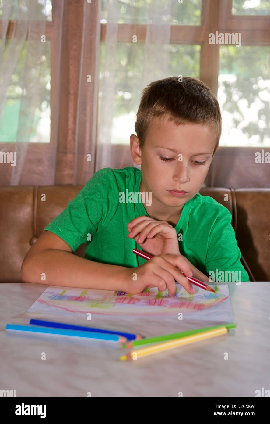 young boy drawing positive picture with pencils Stock Photo - Alamy