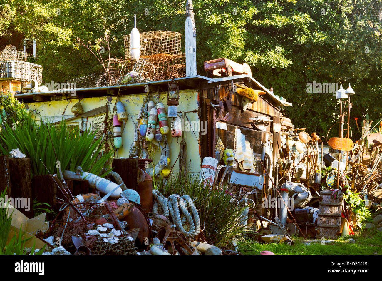 Old shed and piled up junk in a front yard in an artistic display in ...