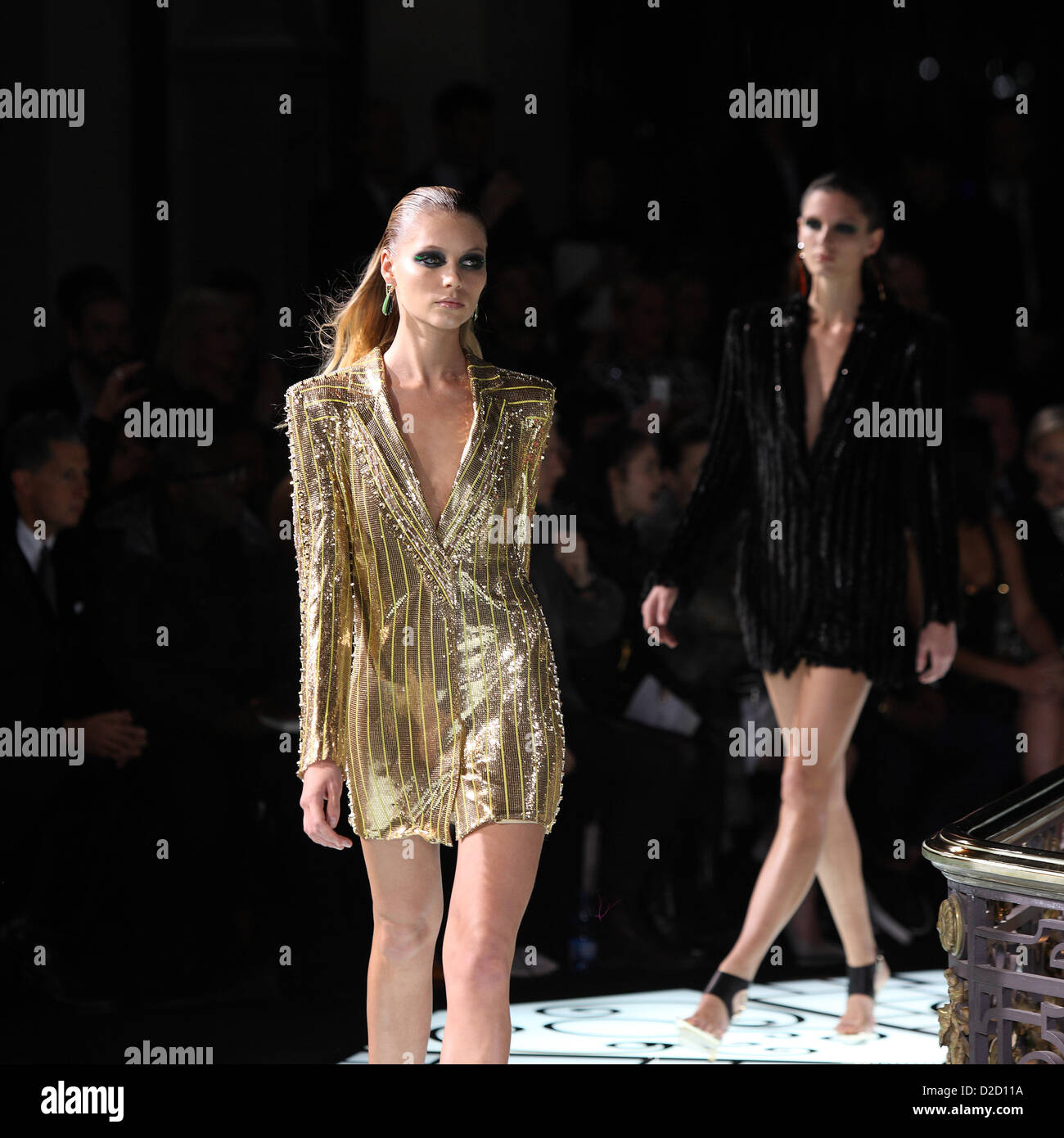 Models wear creations by Italian designer Donatella Versace as part of ...