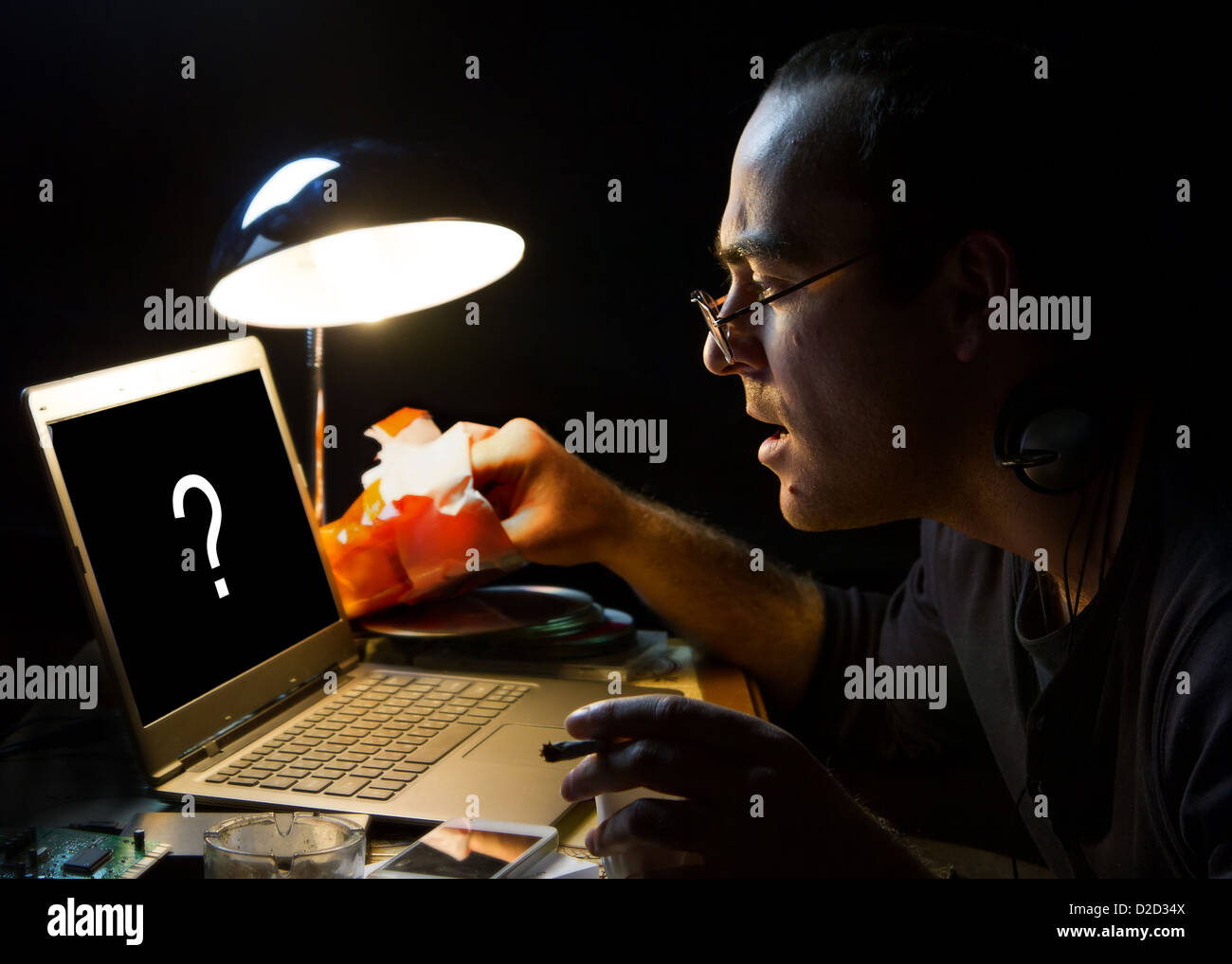 The man in front of a computer screen at night Stock Photo - Alamy
