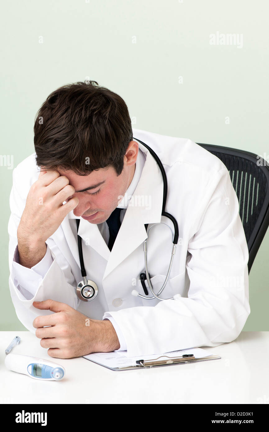 MODEL RELEASED Stressed doctor Stock Photo - Alamy